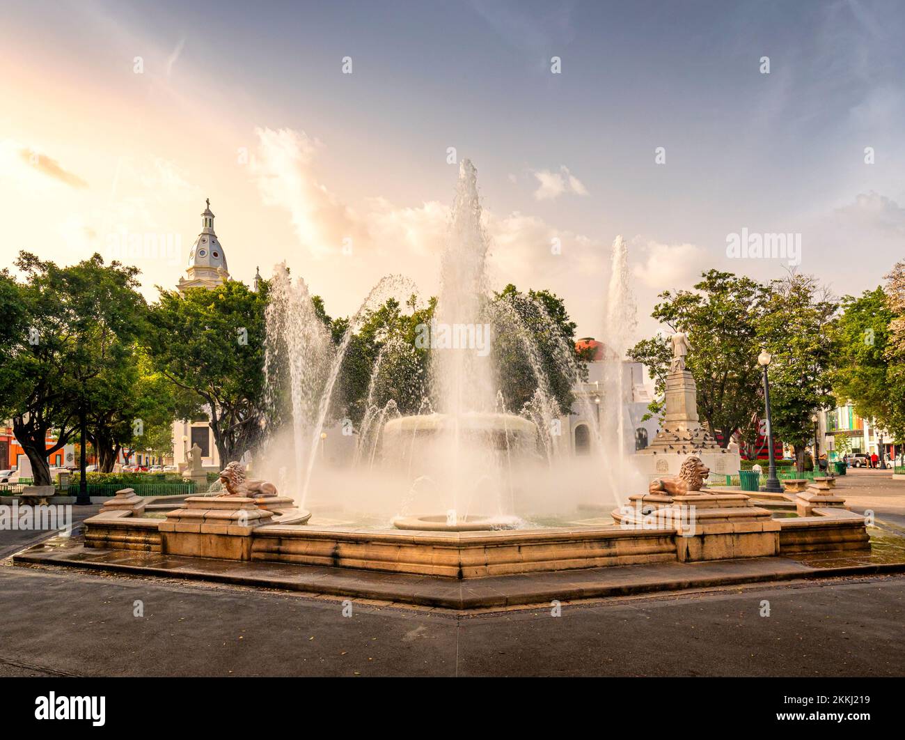 A fountain with the cathedral of Ponce in the background, on the ...