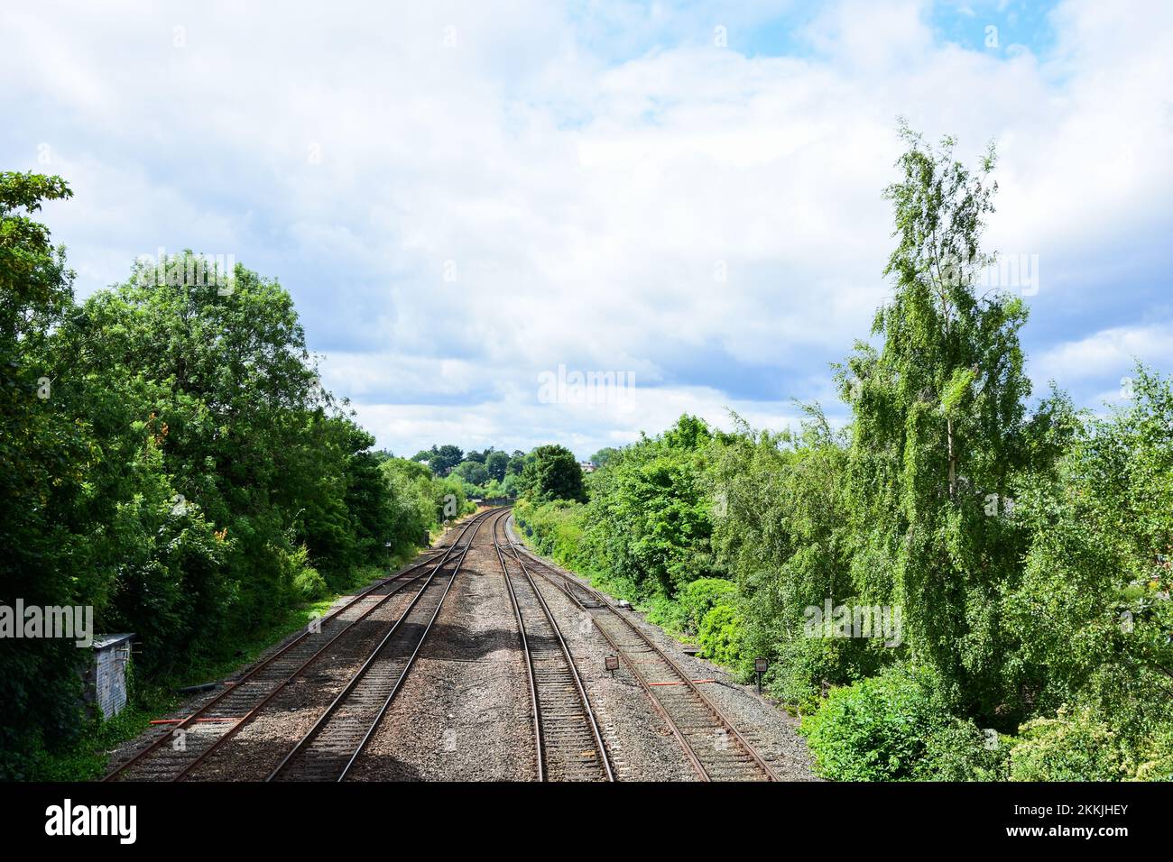 Two railways running parallel to each other, surrounded by lush ...