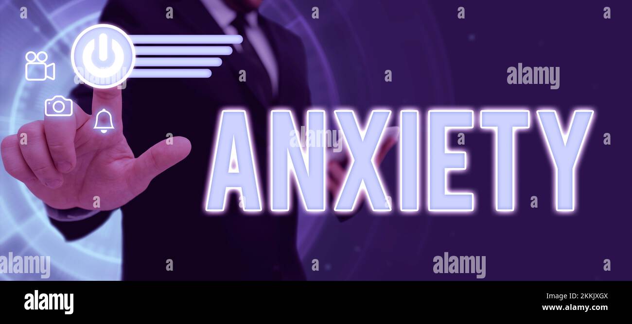 Hand writing sign Anxiety. Business approach Excessive uneasiness and ...
