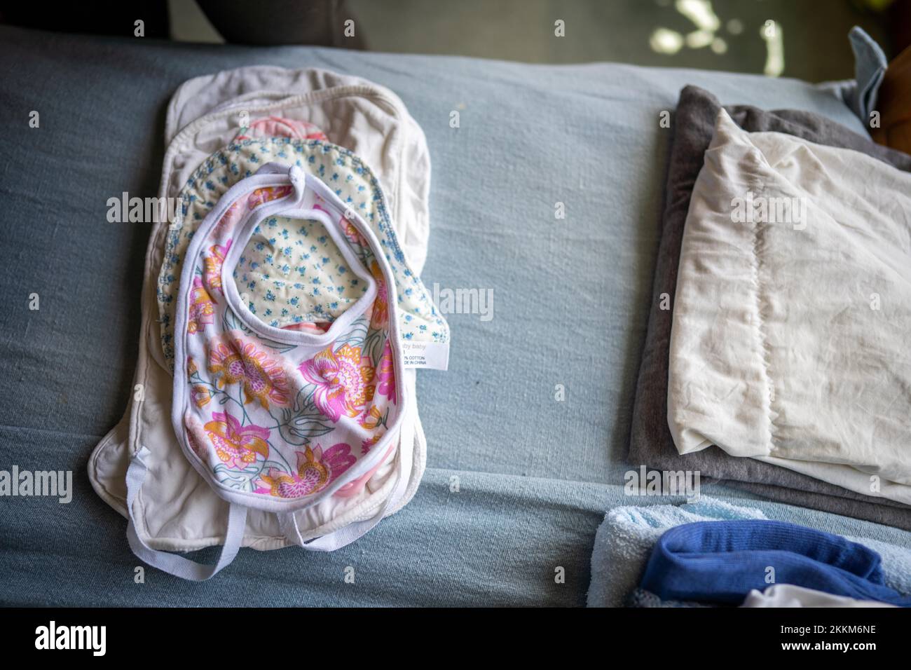 Female folding laundry house hi-res stock photography and images - Alamy