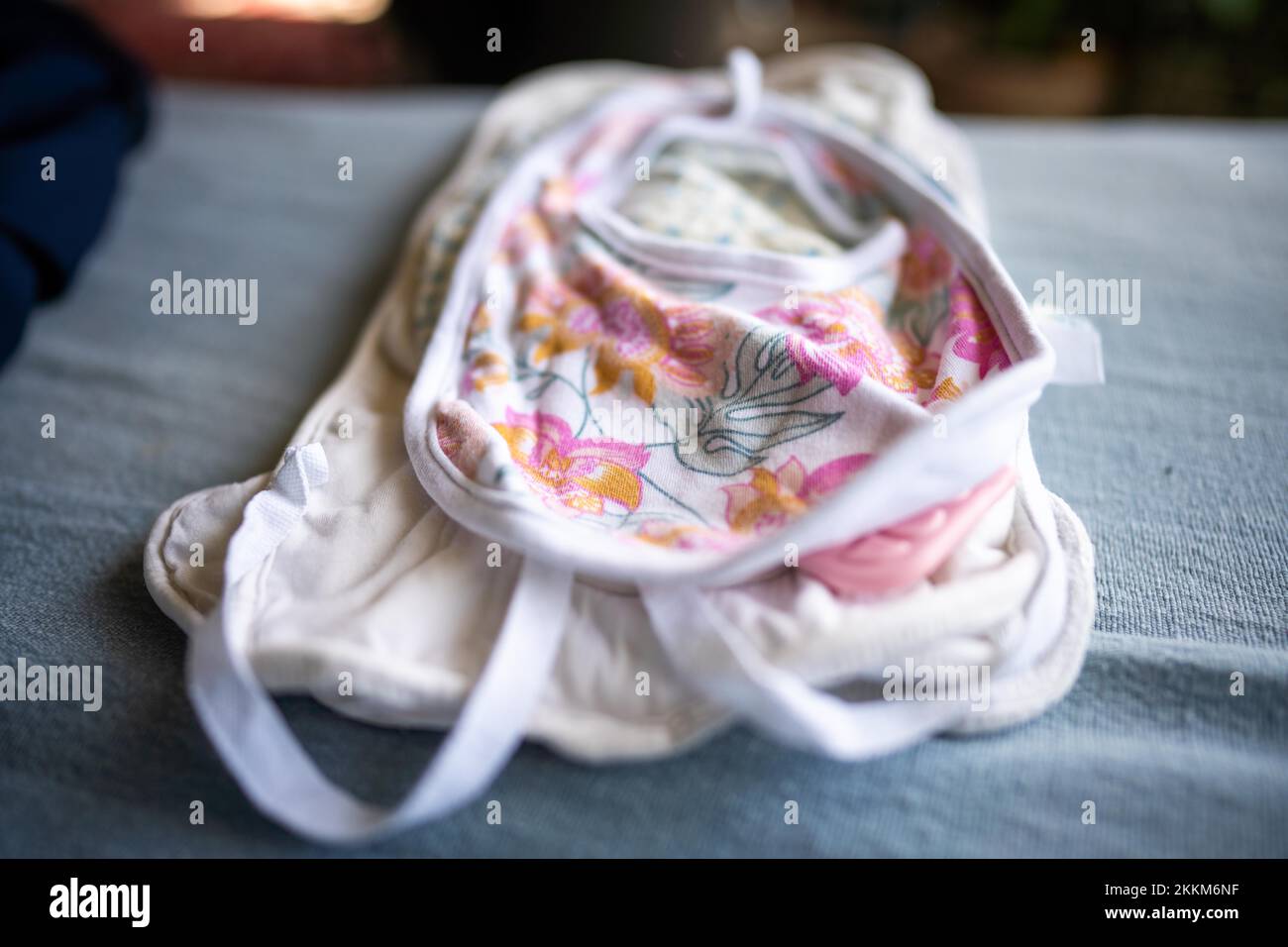 Folding and washing clean baby clothes in a home Stock Photo - Alamy