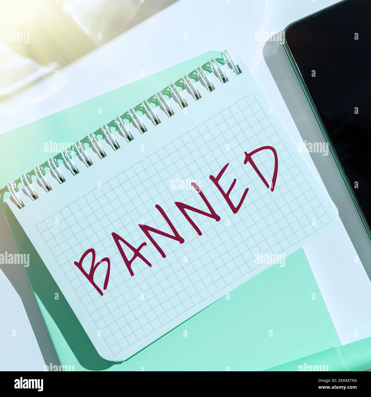 Hand writing sign Banned, Word for Officially prevent someone from ...