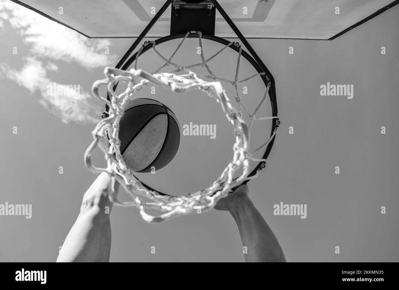 basketball ball flying through basket in players hands, winning Stock ...