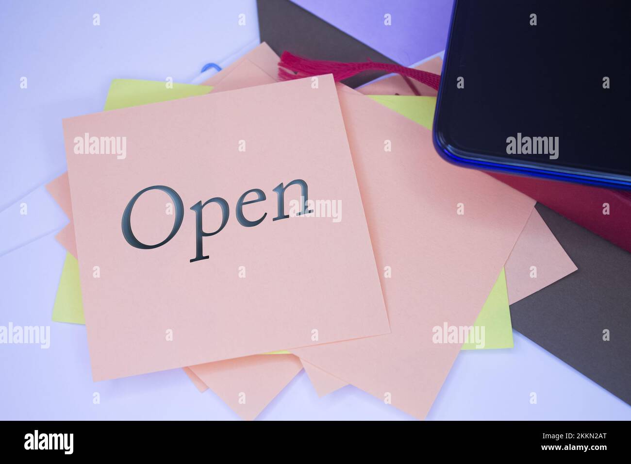 Open. Text on adhesive note paper. Event, celebration reminder message ...