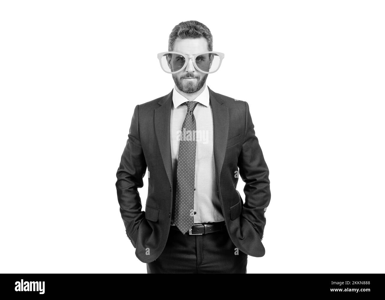 Serious professional man in funny sunglasses and formal suit with hands ...