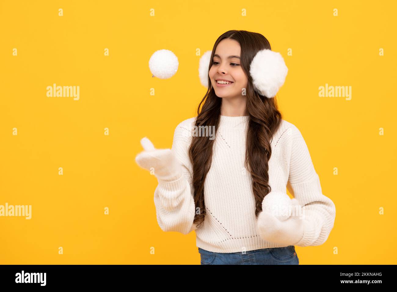 Santa girl in fur sweater isolated on yellow background. Happy New Year ...
