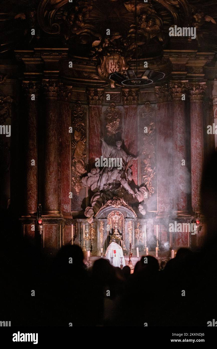 A vertical shot of the interior of a church with a dark theme Stock ...