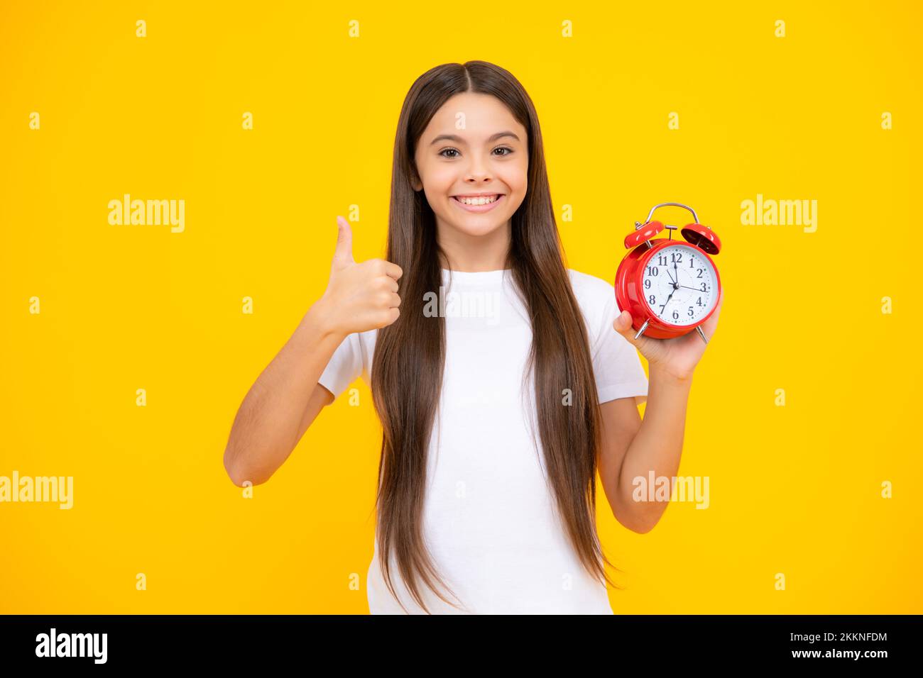 Happy teenager portrait. Child teenager girl with alrm clock isolated ...