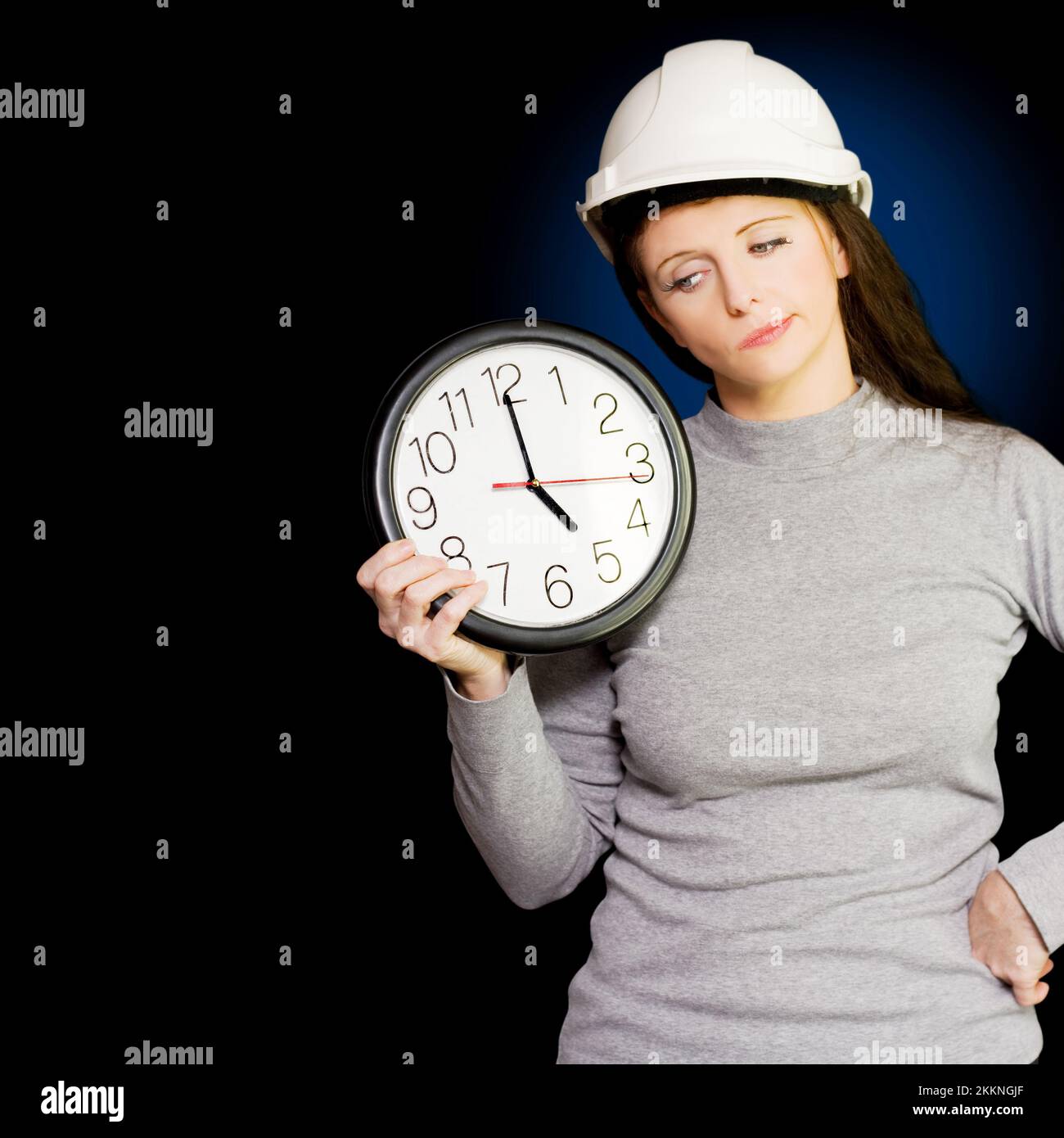 Clock watching woman office hi-res stock photography and images - Alamy