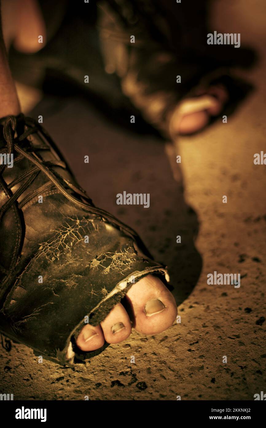 Worn through shoes hi-res stock photography and images - Alamy