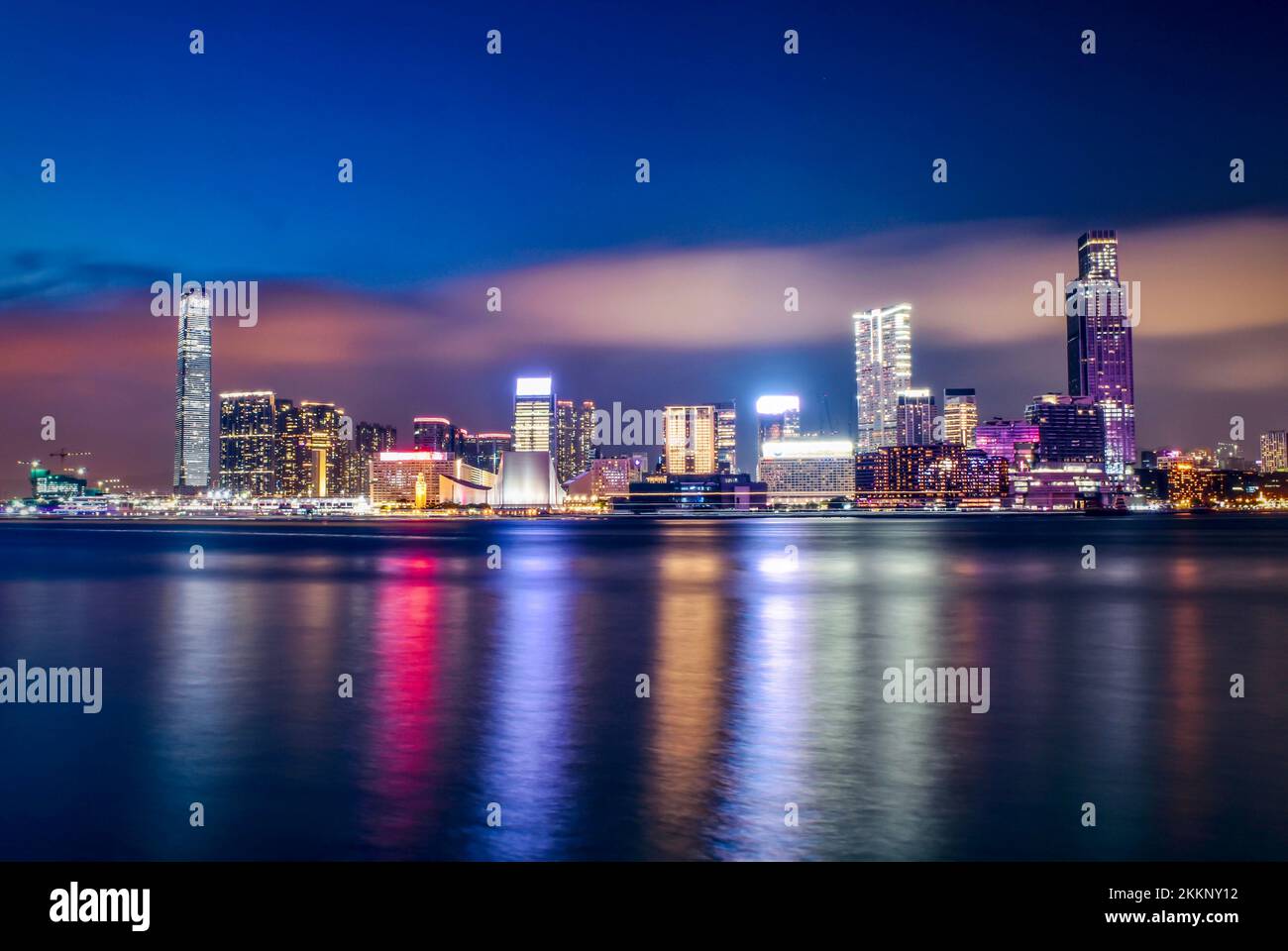 Hong Kong city at night. Tsim Sha Tsui side view of the city Stock Photo - Alamy