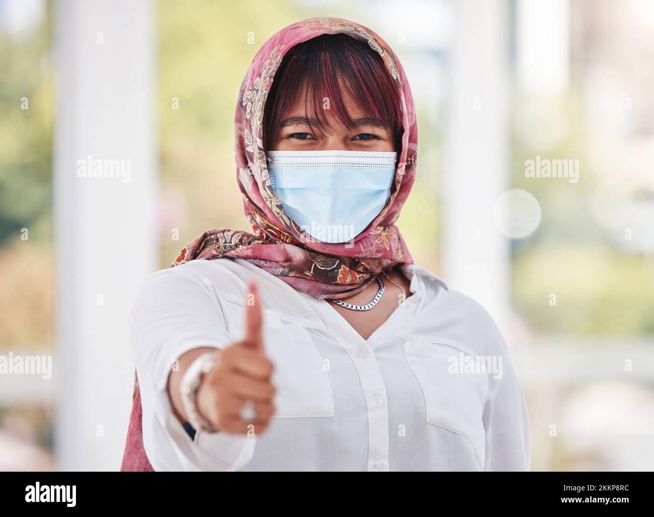 Thumbs up, Islamic woman and mask for covid protection, vaccine and ...