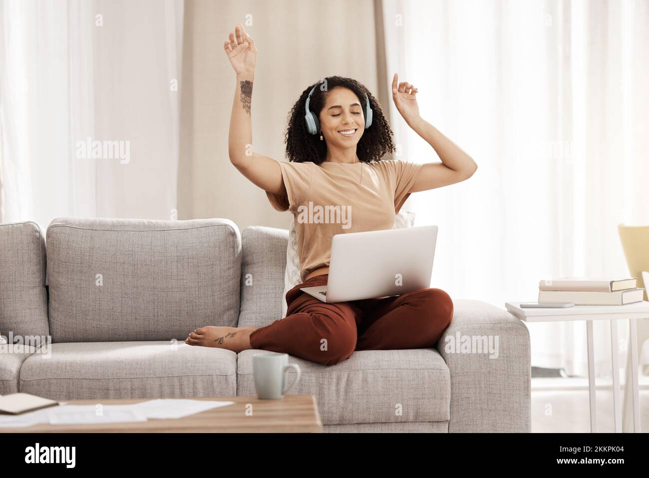 Music, laptop and woman dance, living room sofa and radio, song and ...