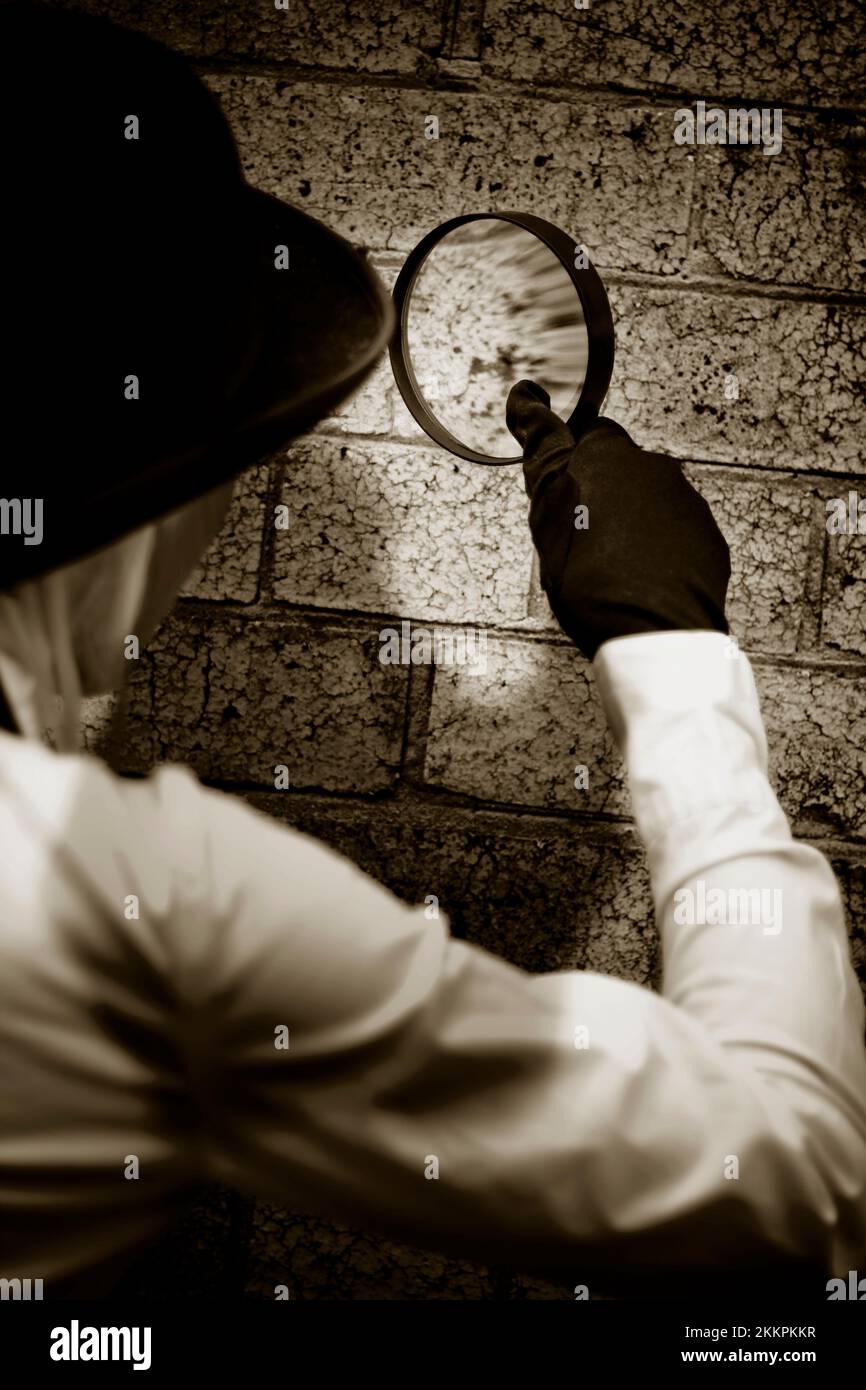 Detective looking clues magnifying glass hi-res stock photography and ...