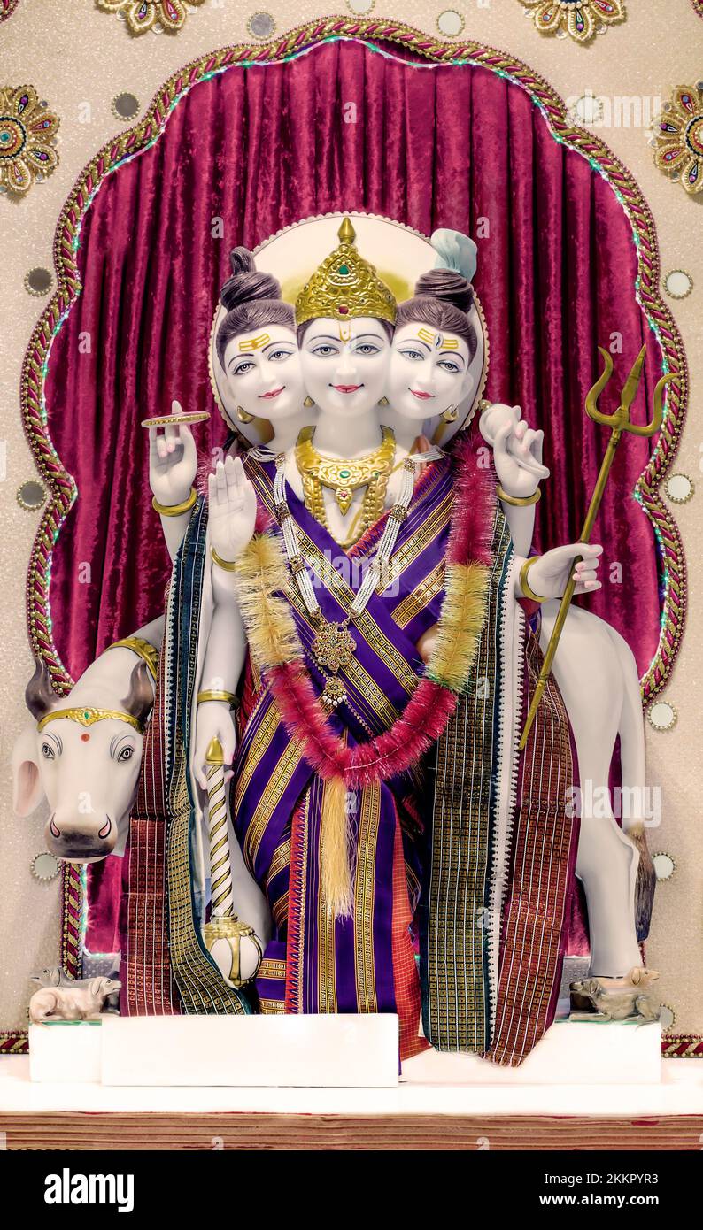 Dattatreya idol in Hindu temple Stock Photo - Alamy