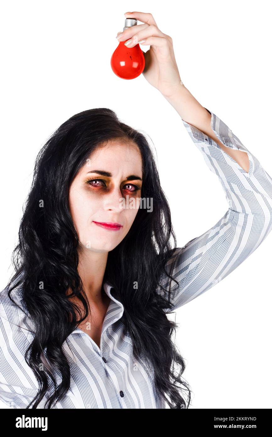 Zombie woman holding red light bulb above her head as red alert warning ...