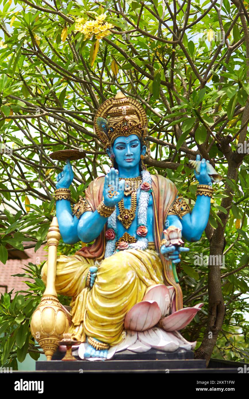 A sculpture of a blue multi-armed shiva. Gods of Indo-Buddhism on the ...