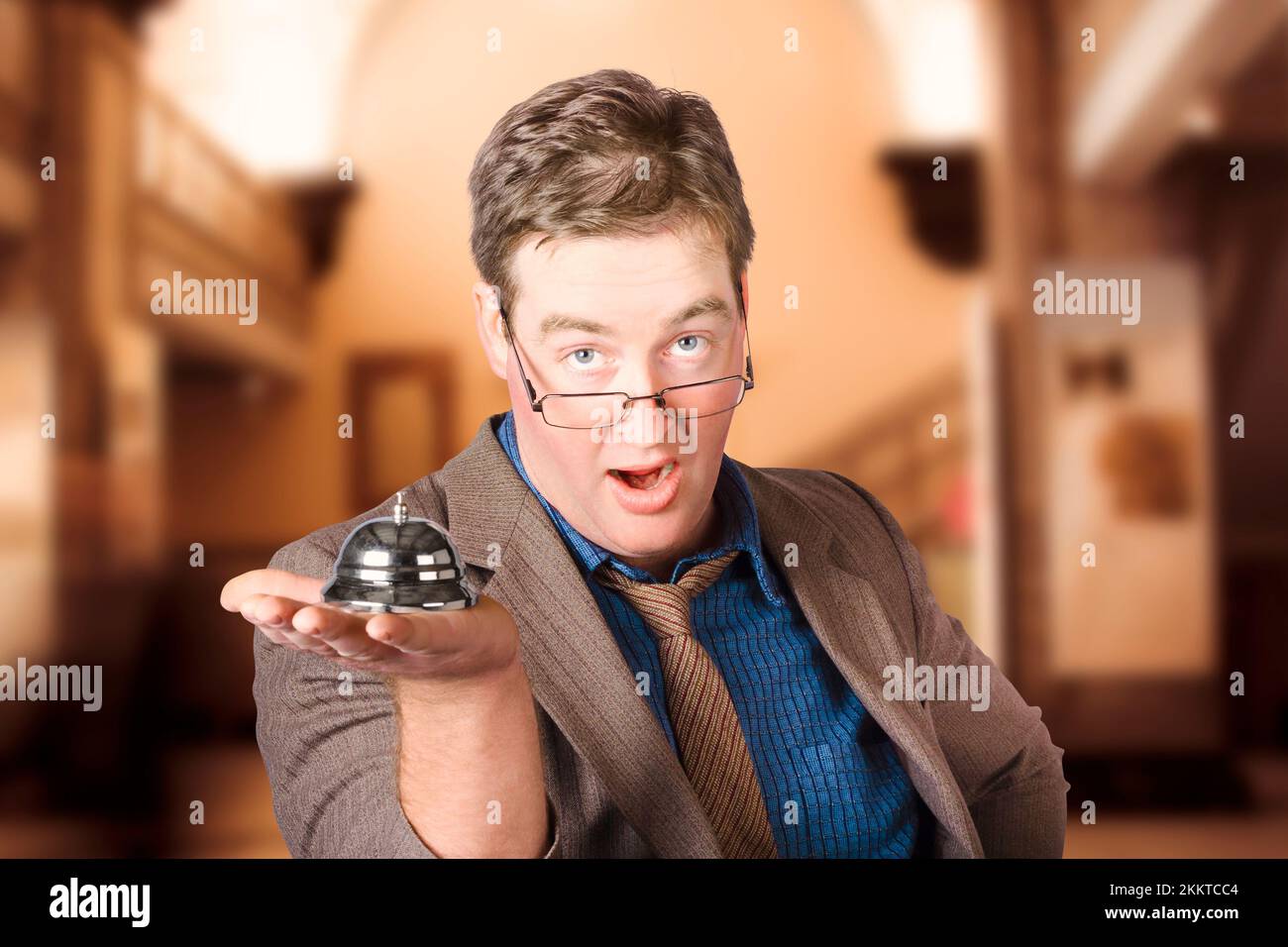 Shocked male customer holding retail service bell. Unexpected service ...