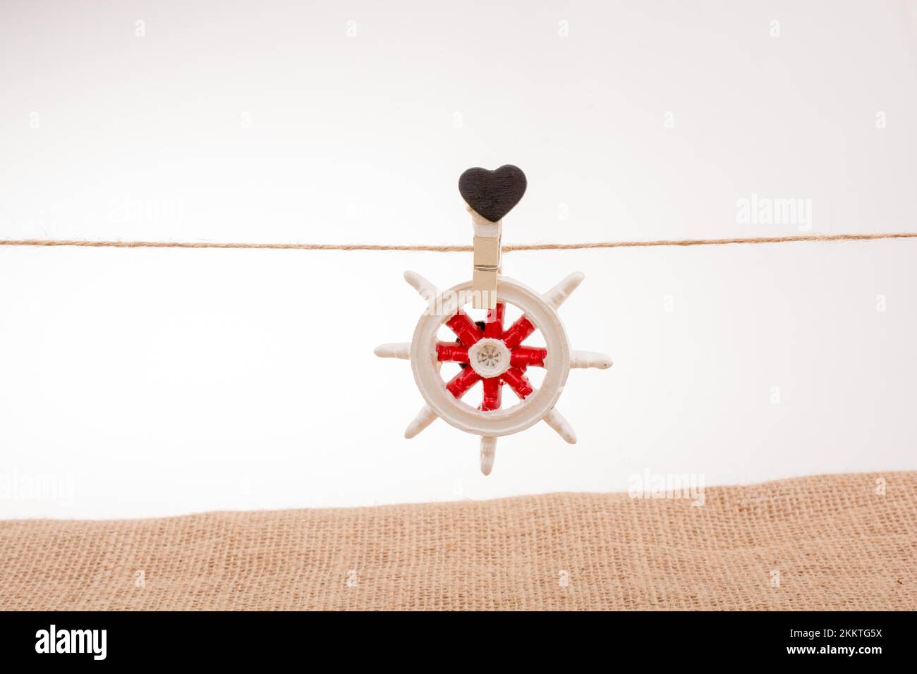 Steering wheel attached to a string Stock Photo - Alamy