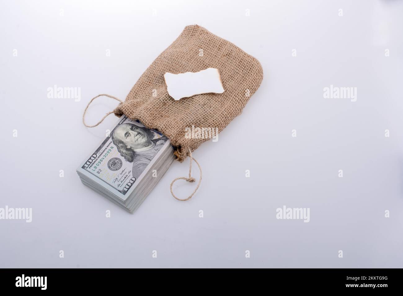 Banknote bundle of US dollarin a sack with a note paper Stock Photo - Alamy