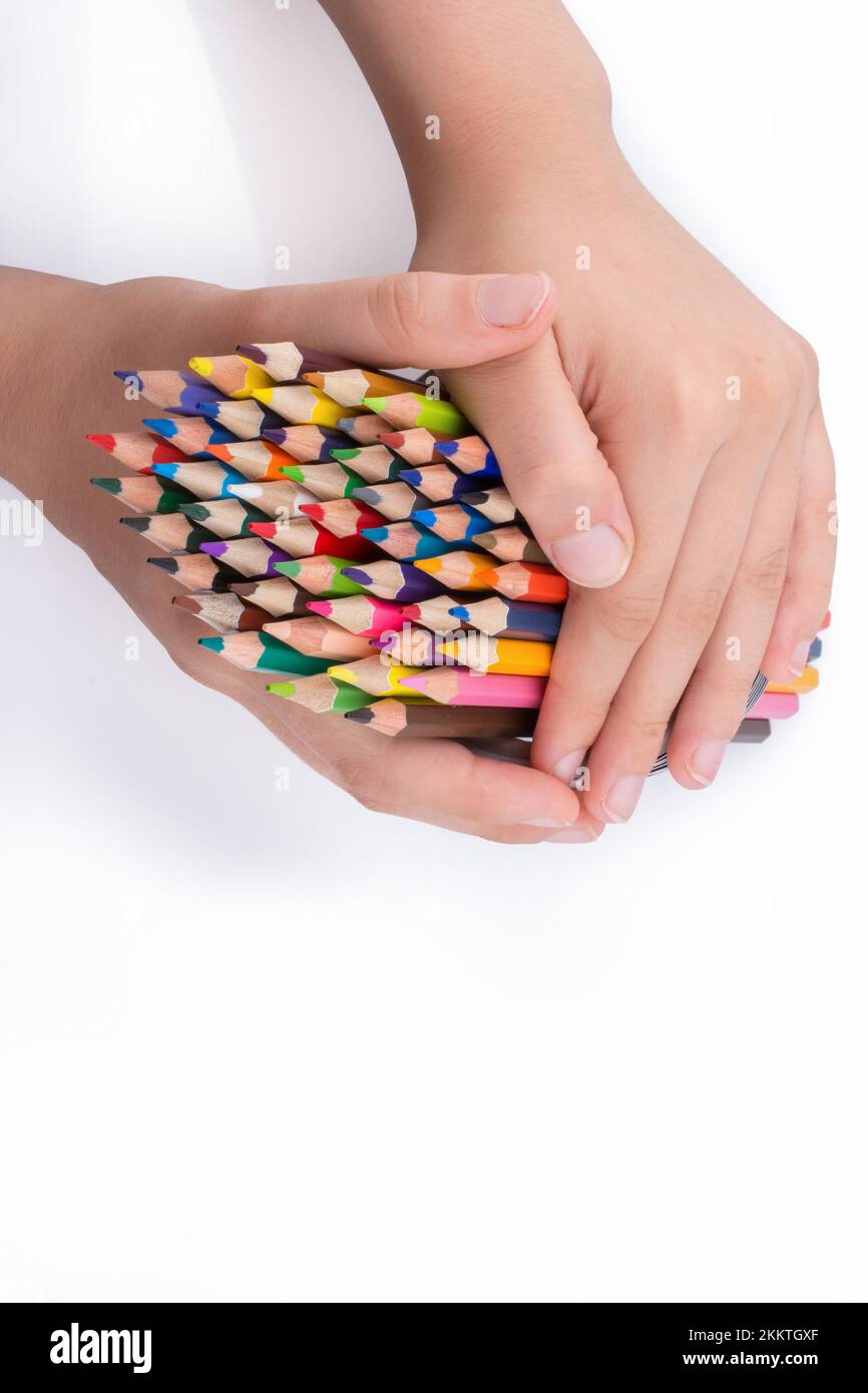 Hand holding Color Pencils on a white background Stock Photo - Alamy