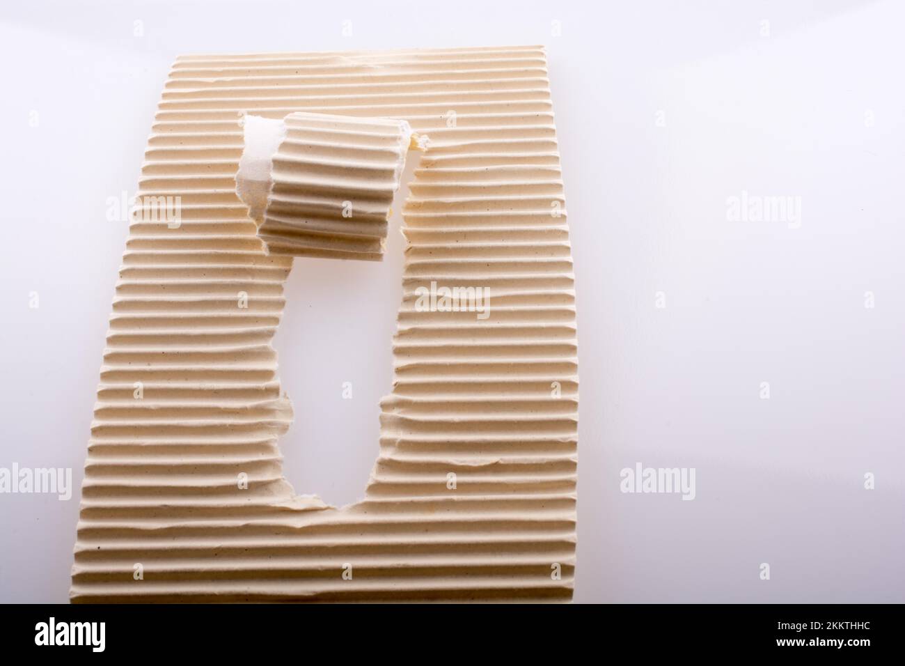 Rolled up torn paper on a white background Stock Photo - Alamy