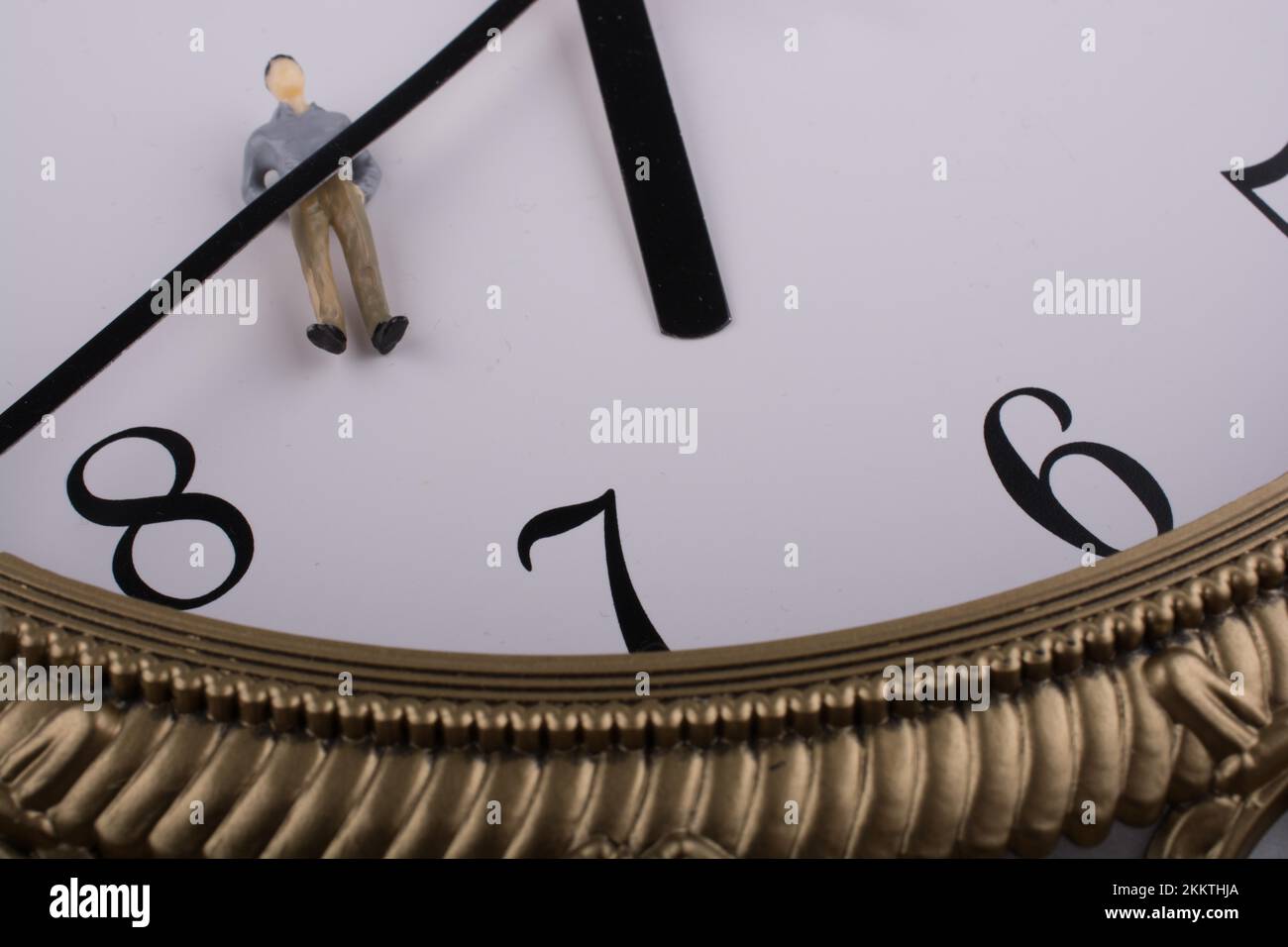 Model man in a clock on a white background Stock Photo - Alamy