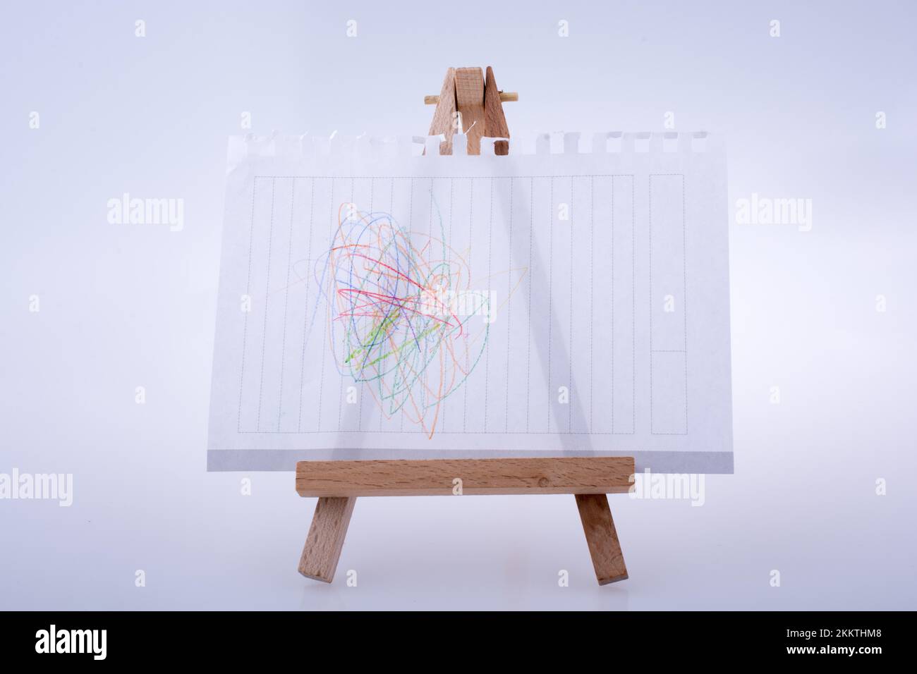 Sheet of white paper put on tripod for painting on white background ...