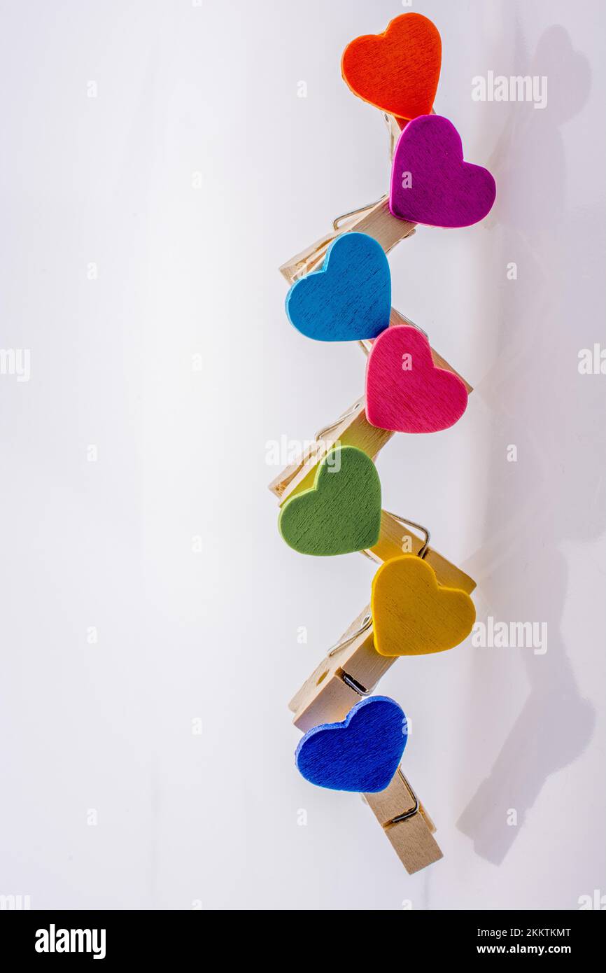 Colorful clothespin attached one another form a zigzag Stock Photo - Alamy