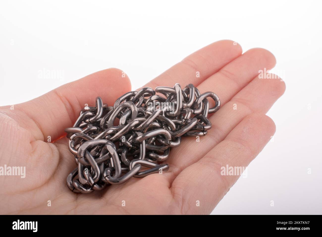 Chain in hand on a white background Stock Photo - Alamy