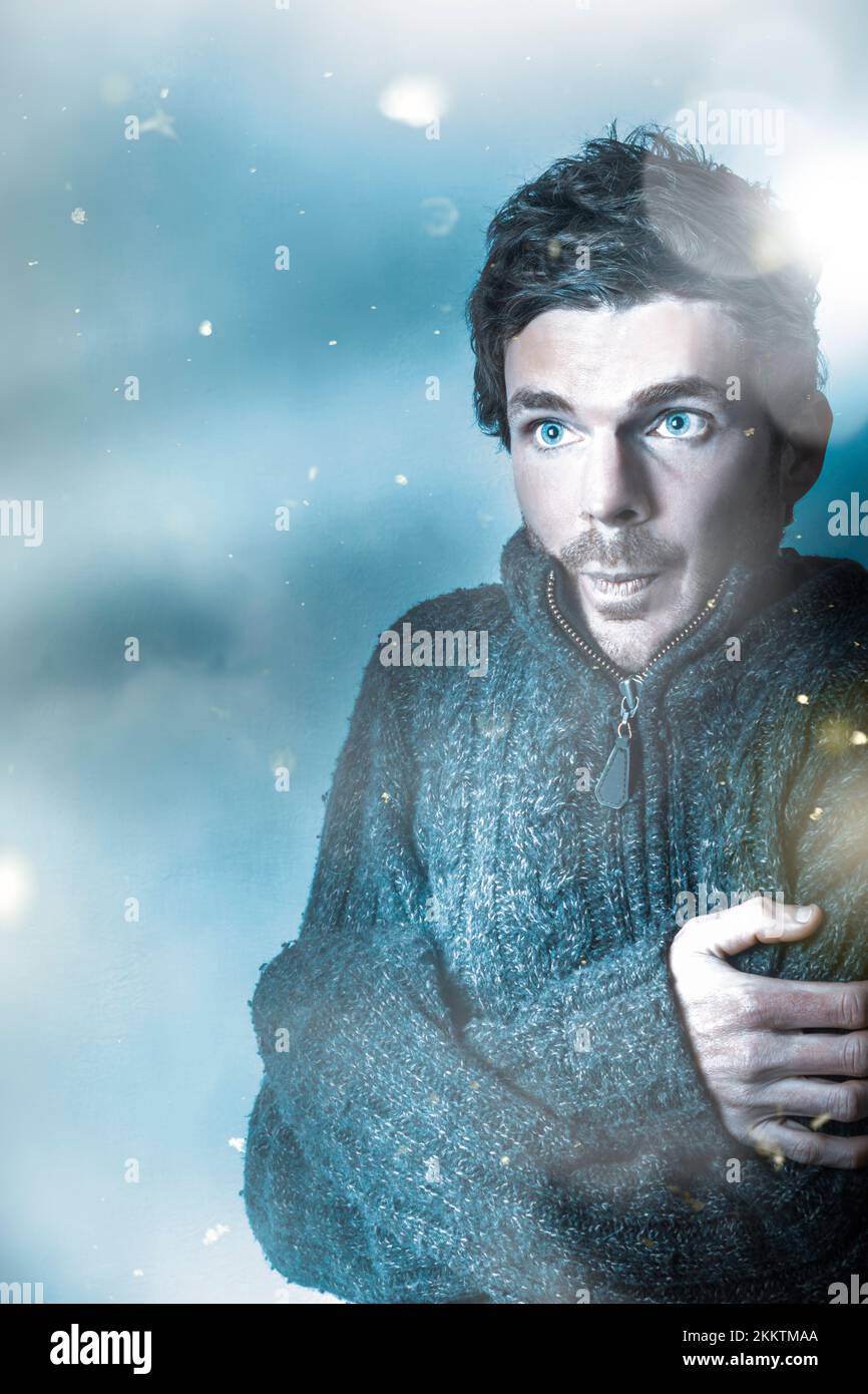 Artistic winter fashion portrait of a cold young man freezing in the ...