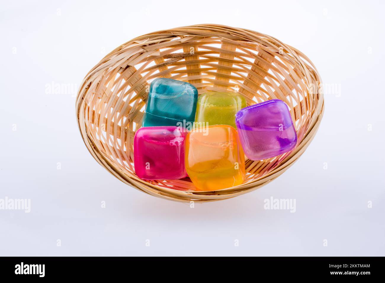 Fake colorful ice cubes in basket on a white background Stock Photo - Alamy