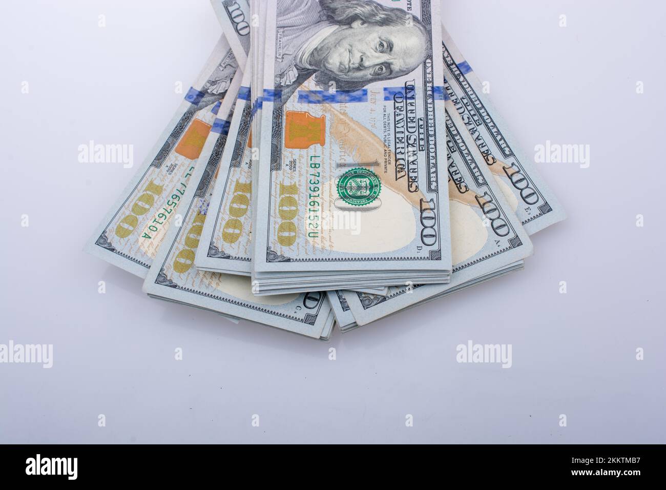 American 100 dollar banknote bundles placed on white background Stock ...