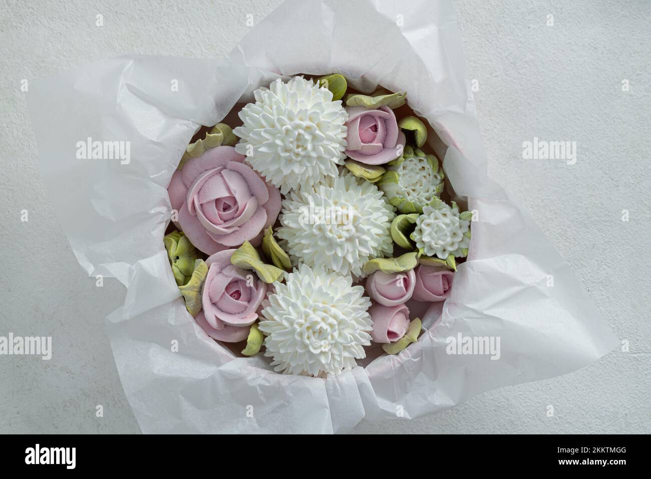 Zephyr bouquet of flowers in a gift box on a light background ...