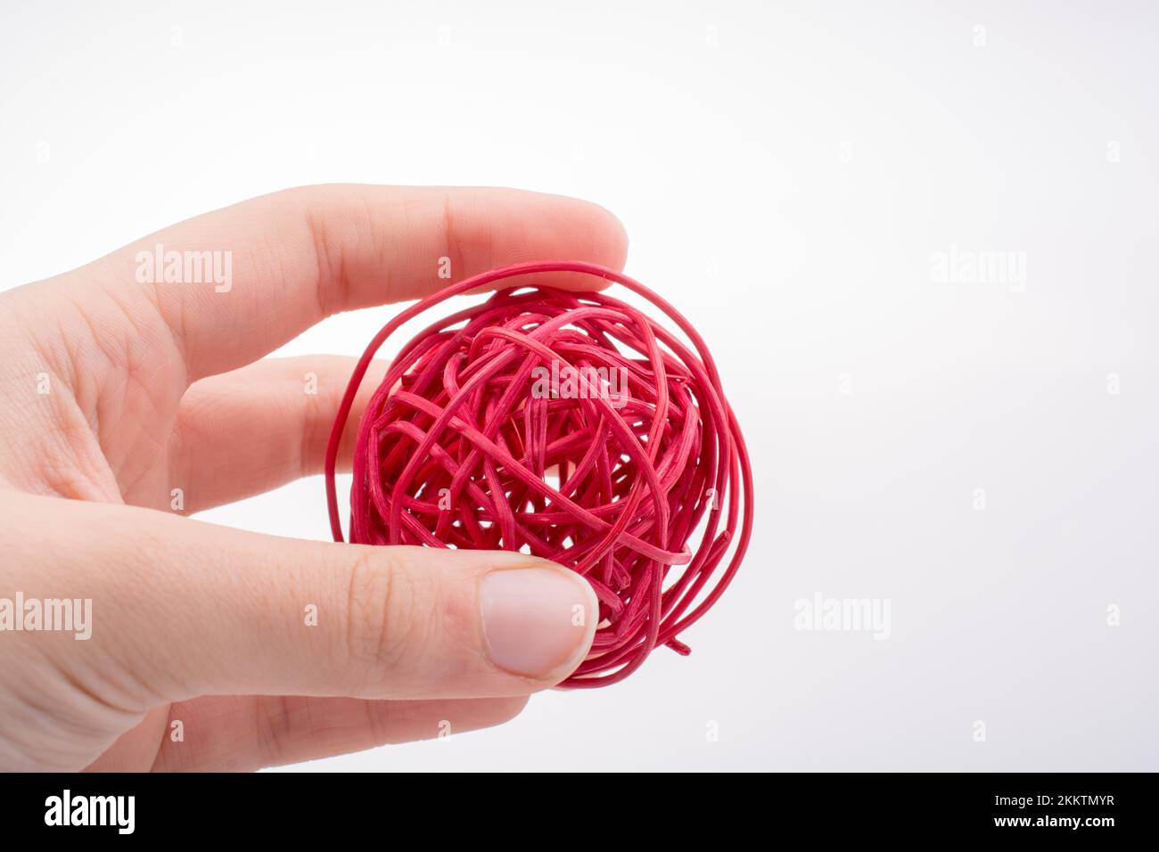 Roll of colotful string in the hand Stock Photo - Alamy
