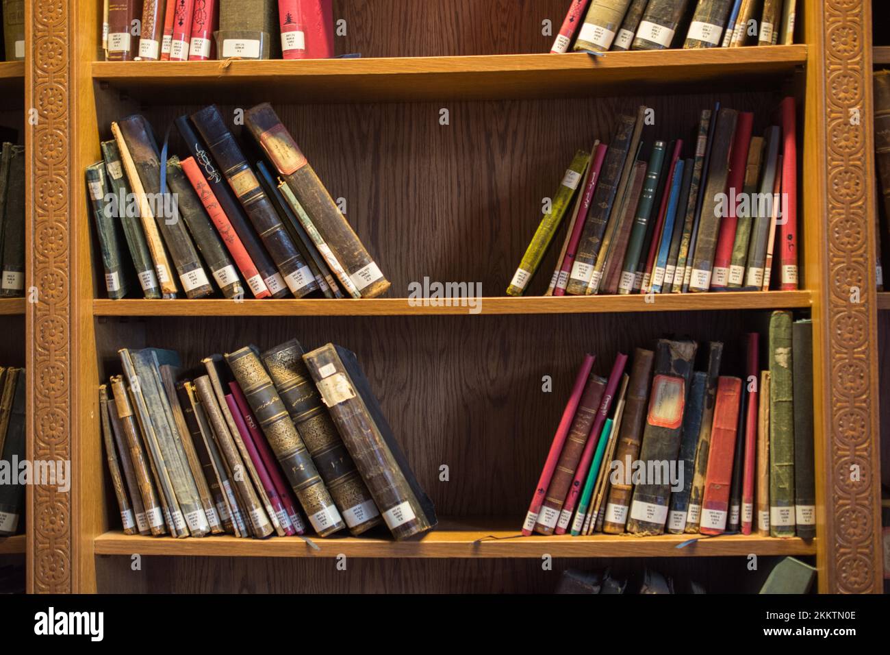 Bookshelf with old Turkish Ottoman handwriting books Stock Photo - Alamy