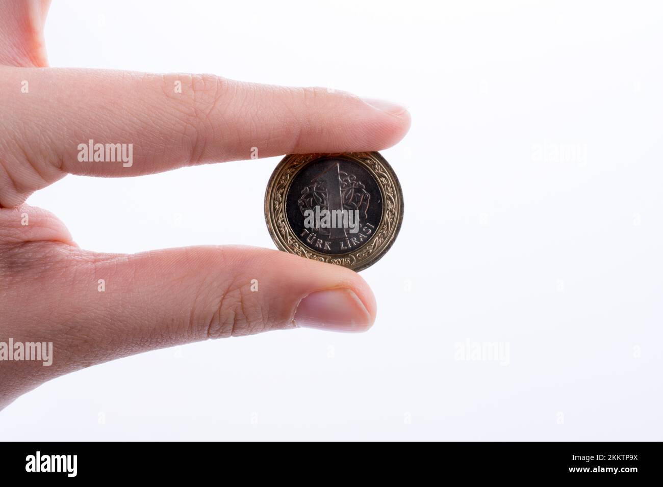 Turkish coin one Turkish Lira in hand Stock Photo - Alamy