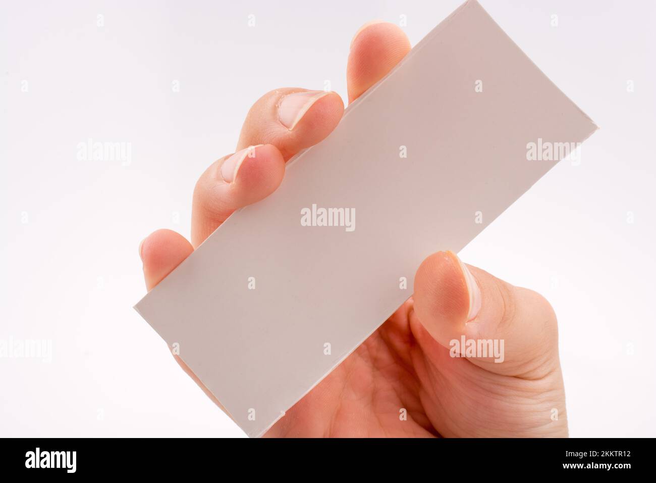 Hand holding a note paper on a white background Stock Photo - Alamy