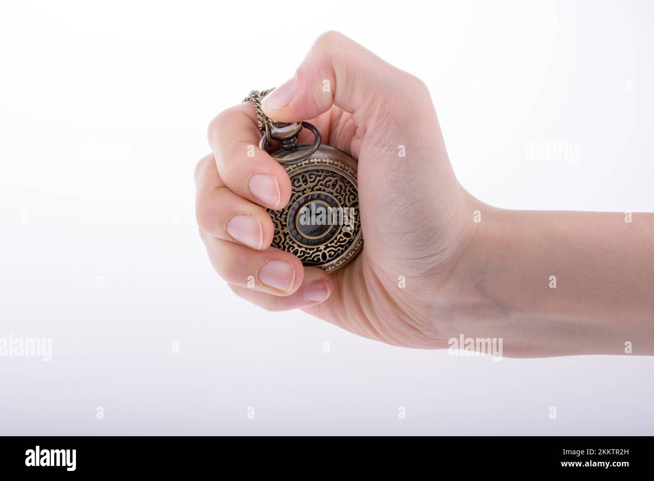 Hand holding a retro styled pocket watch in hand Stock Photo - Alamy