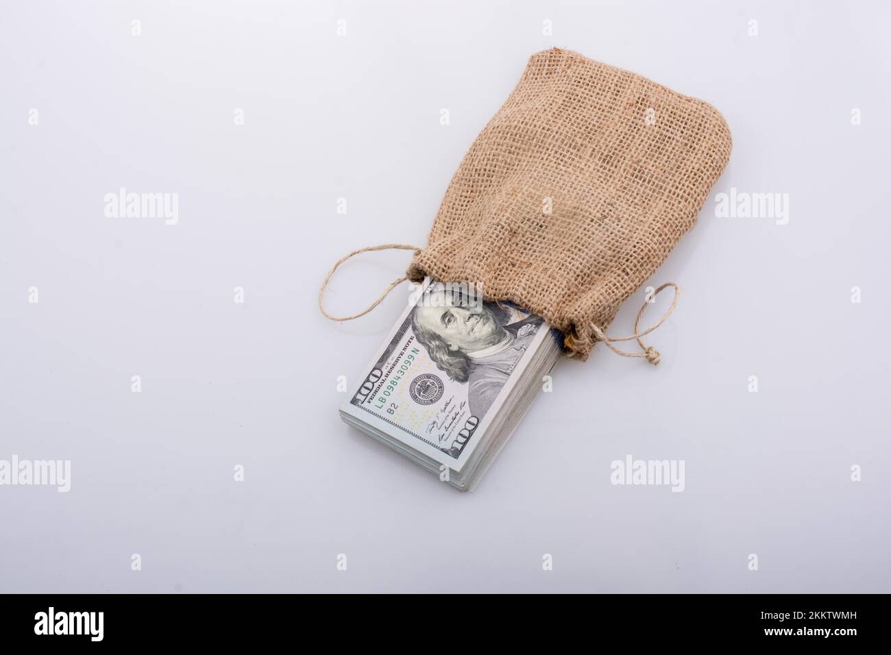 Banknote bundle of US dollarin a sack on a white background Stock Photo ...