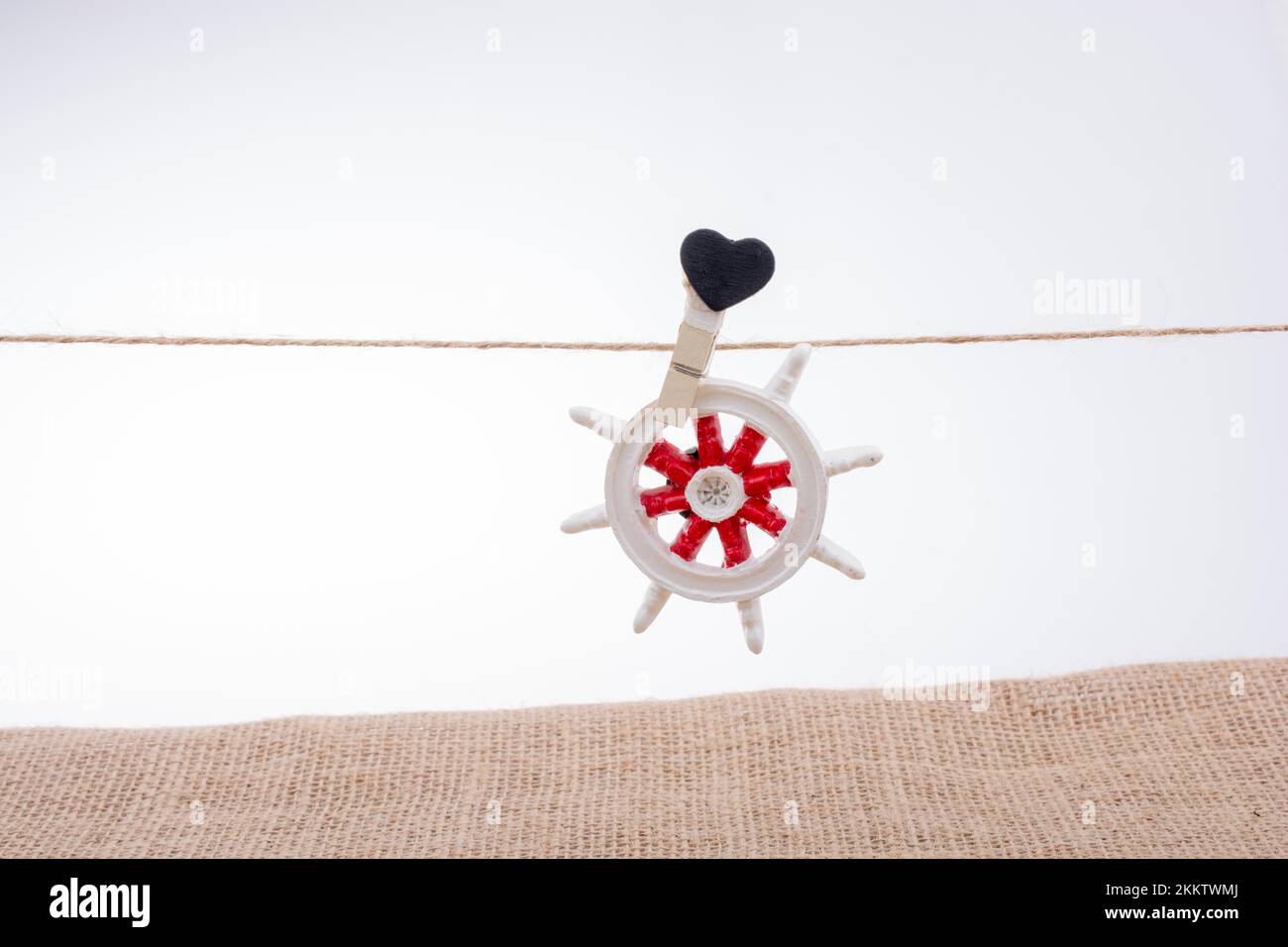 Steering wheel attached to a string Stock Photo - Alamy