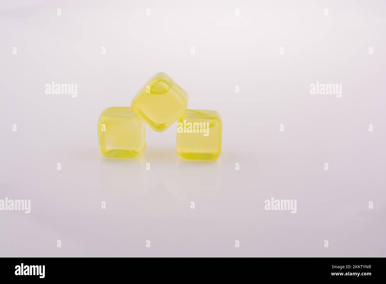 Fake colorful ice cubes on a white background Stock Photo - Alamy