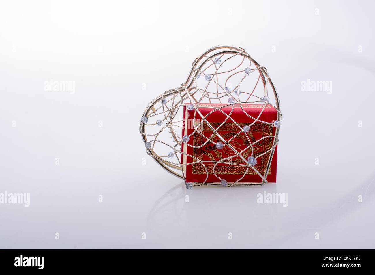 Holy quran in heart hi-res stock photography and images - Alamy