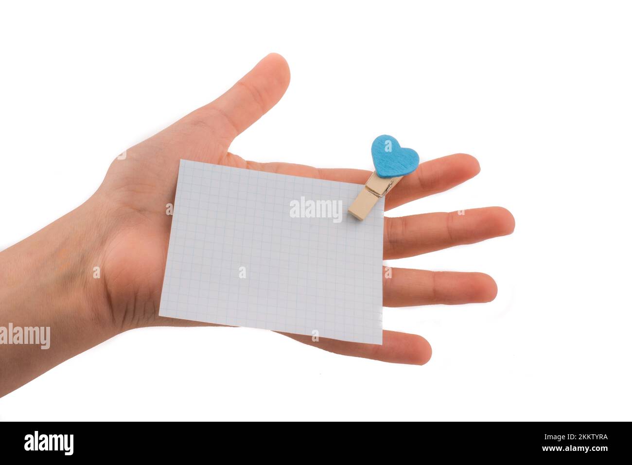 Hand holding a piece of paper on a white background Stock Photo - Alamy
