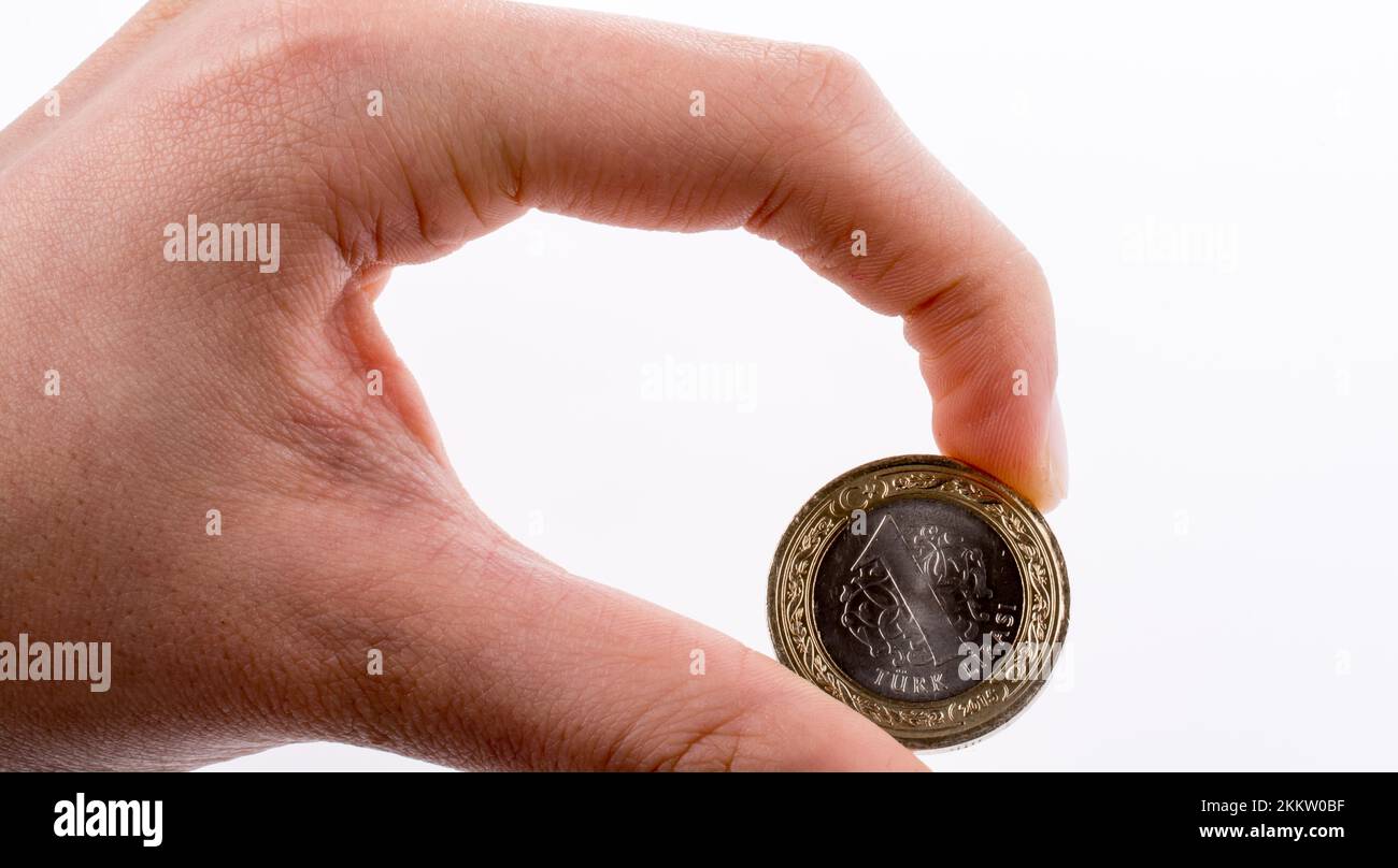 Turkish coin one Turkish Lira in hand Stock Photo - Alamy