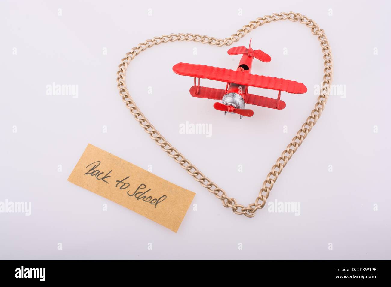 Chain forms a heart shape with a title back to school in it with a red ...