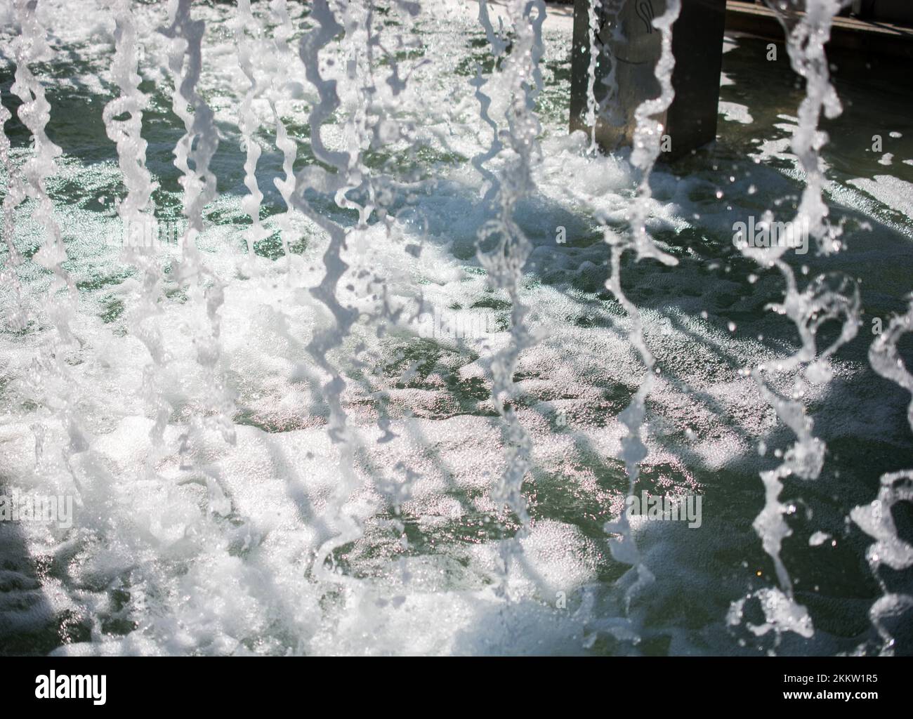The fountains gushing sparkling water in a pool in a park Stock Photo ...