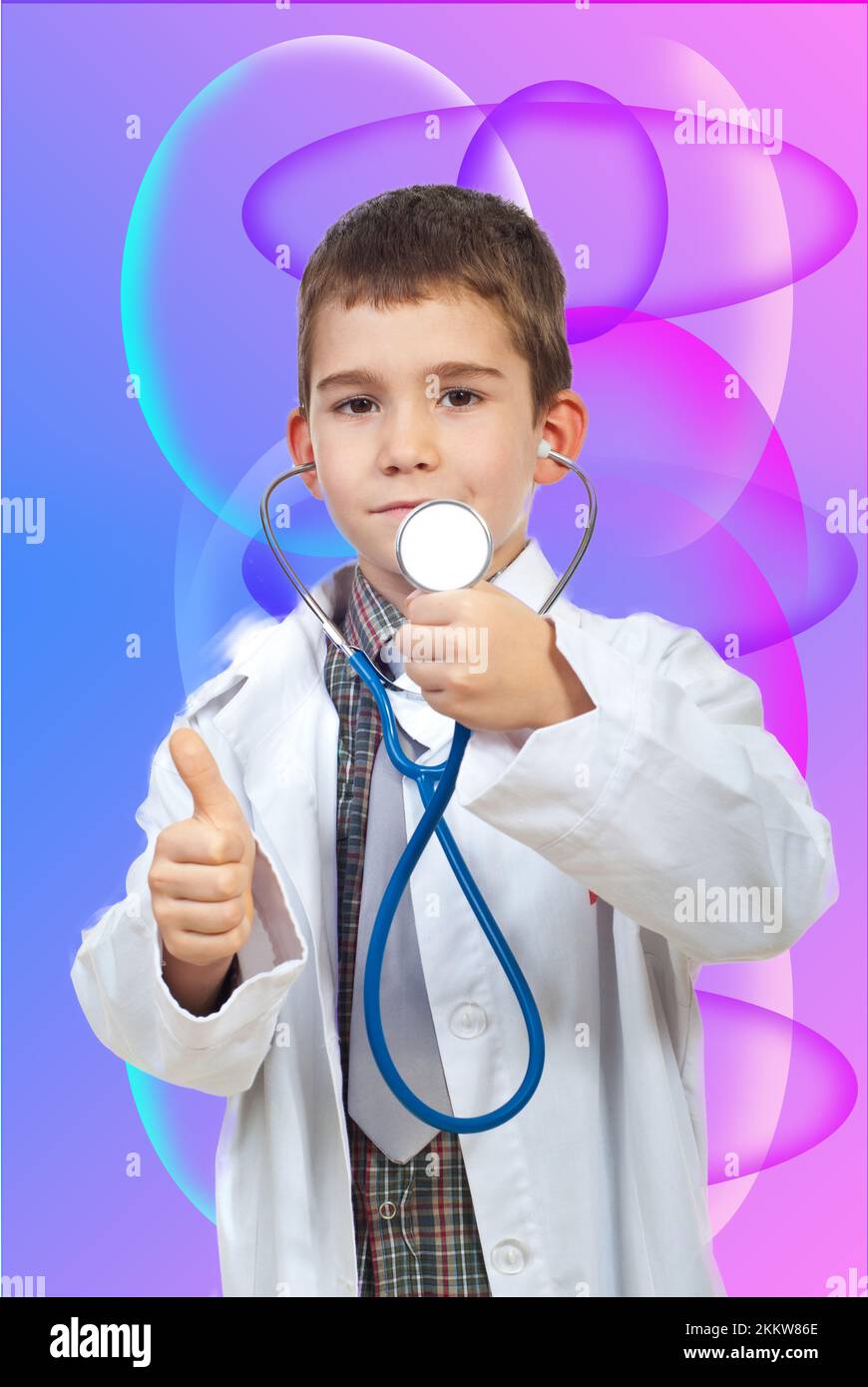 Successful future doctor boy showing stethoscope and giving thumbs upo ...