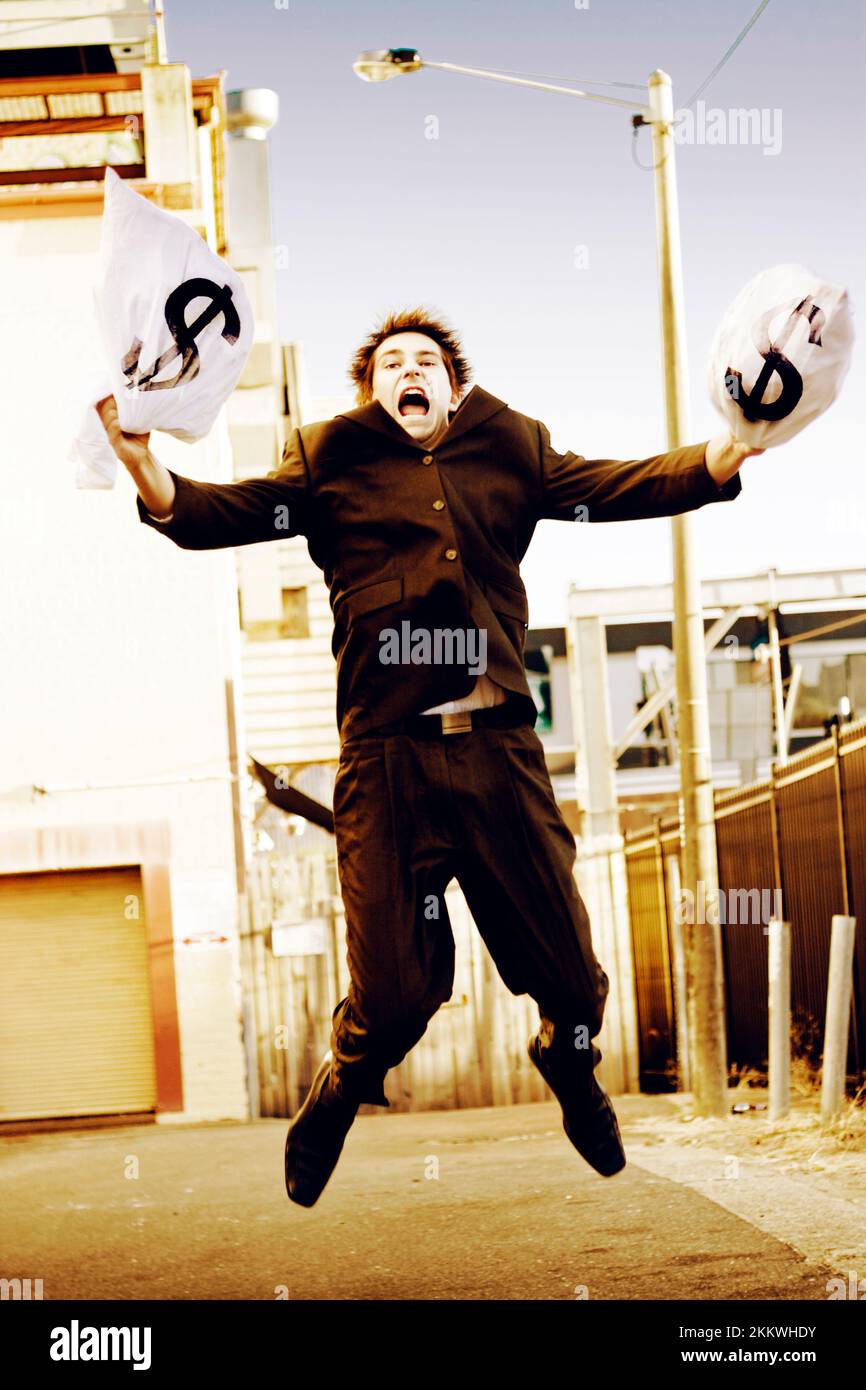 Funny And Humorous Action Portrait Of A Male Business Person Leaping On ...