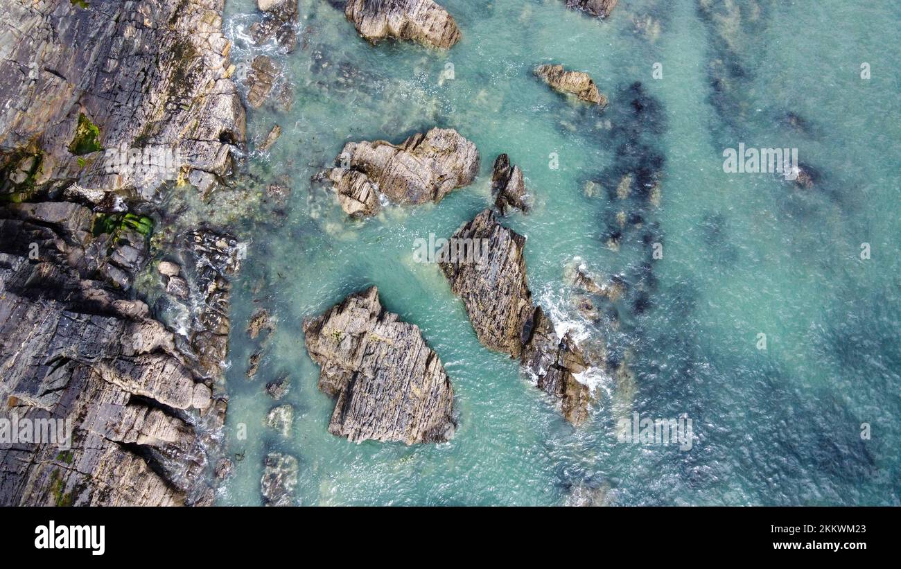 A lot of boulders in the sea. Coastal cliffs of the North Atlantic ...
